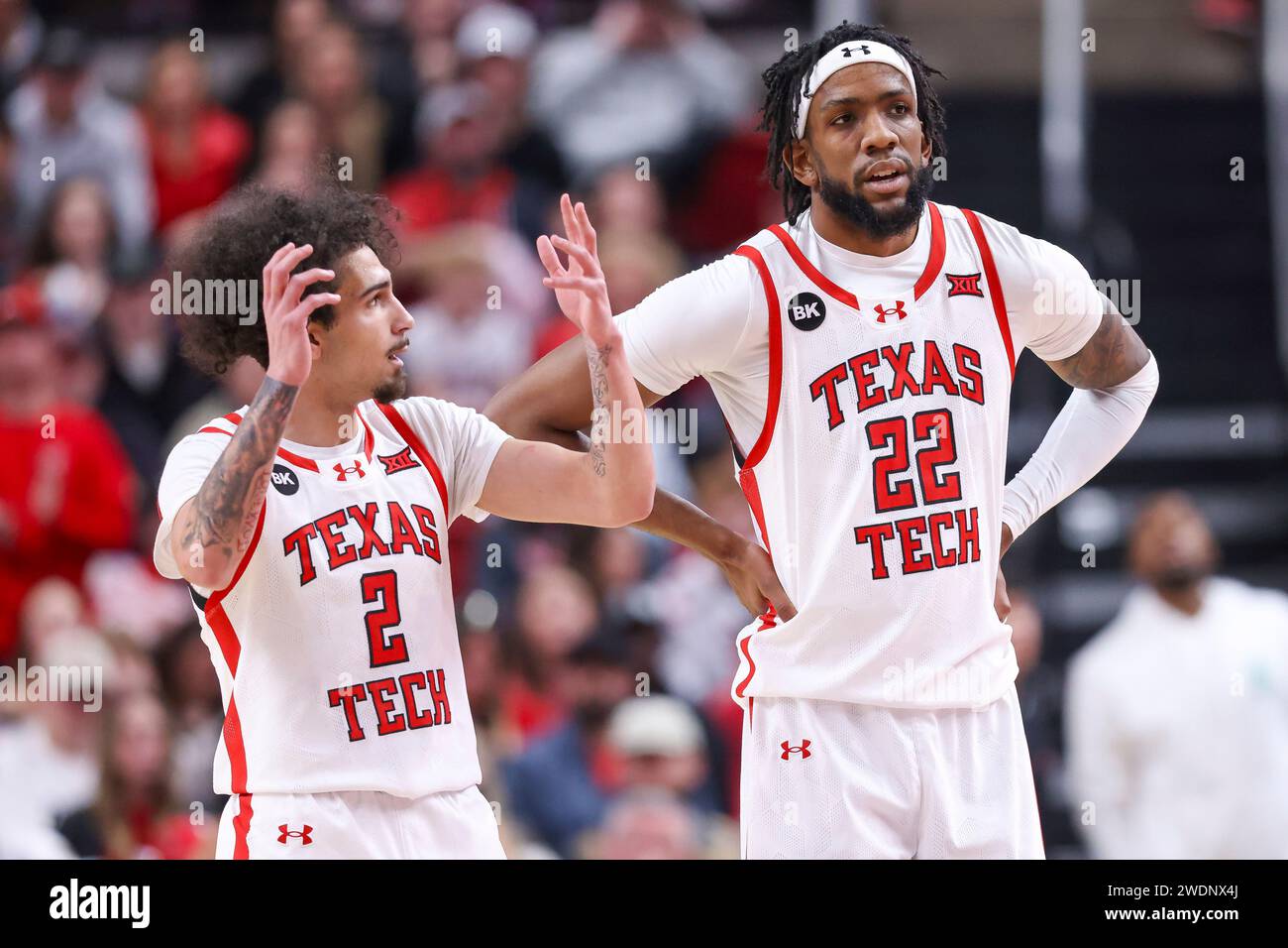 Texas Tech's guard Pop Isaacs (2) talks to forward Warren Washington ...
