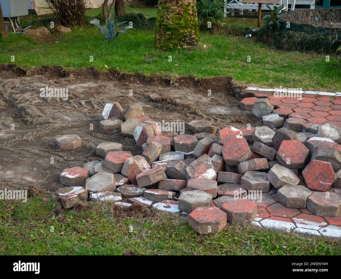 Reconstruction of the bike path. Replacing tiles on a bike path among ...