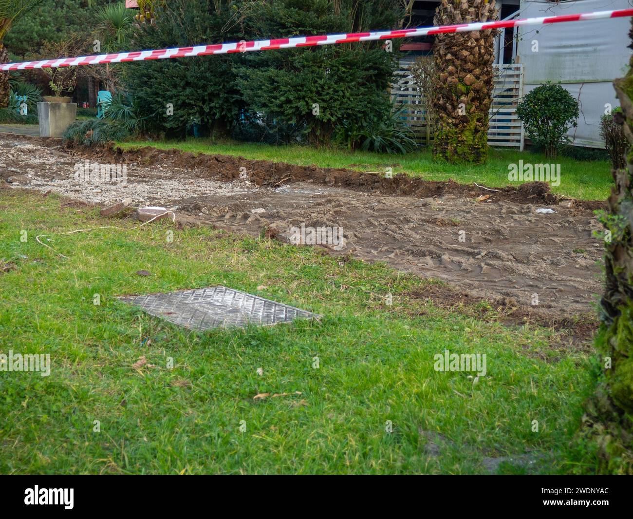 Reconstruction of the bike path. Replacing tiles on a bike path among ...
