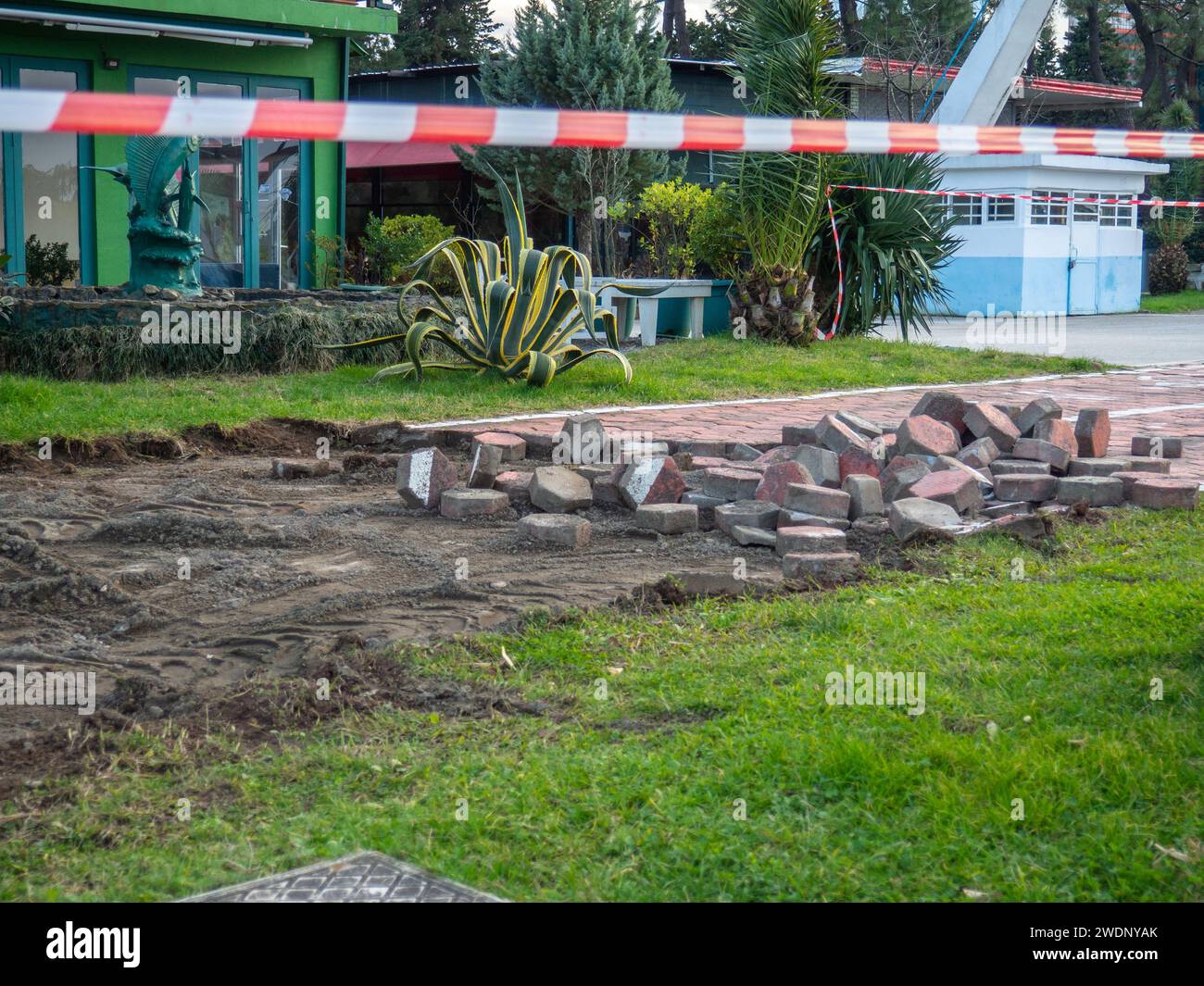 Reconstruction of the bike path. Replacing tiles on a bike path among ...