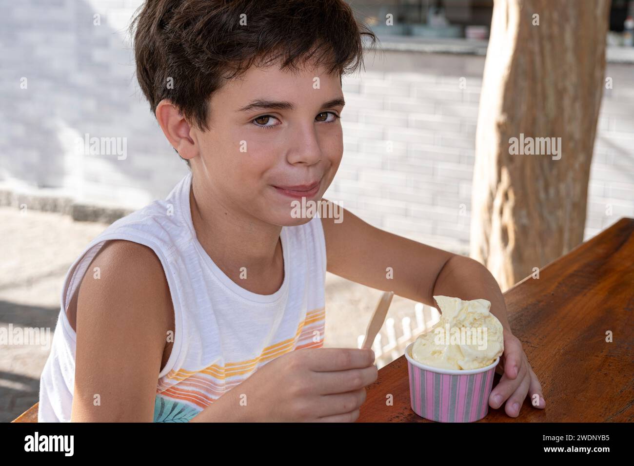 10 year old Brazilian child eating ice cream on a sunny afternoon 5 ...