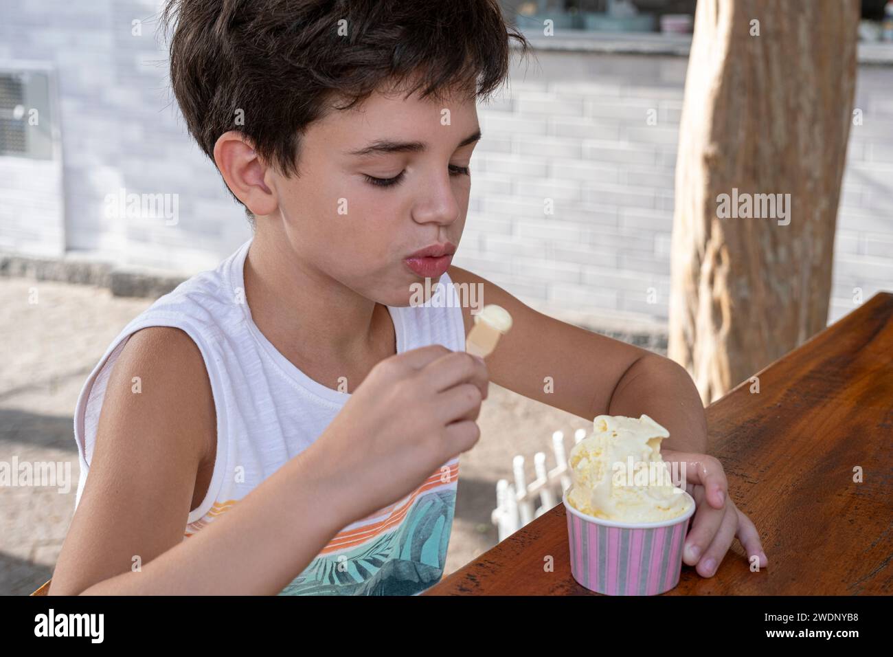10 year old Brazilian child eating ice cream on a sunny afternoon 6 ...