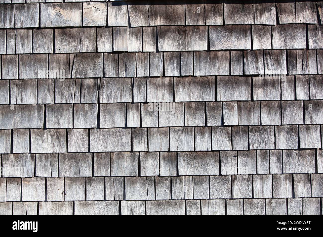 Traditional weathered cedar shakes protect new England home some ...