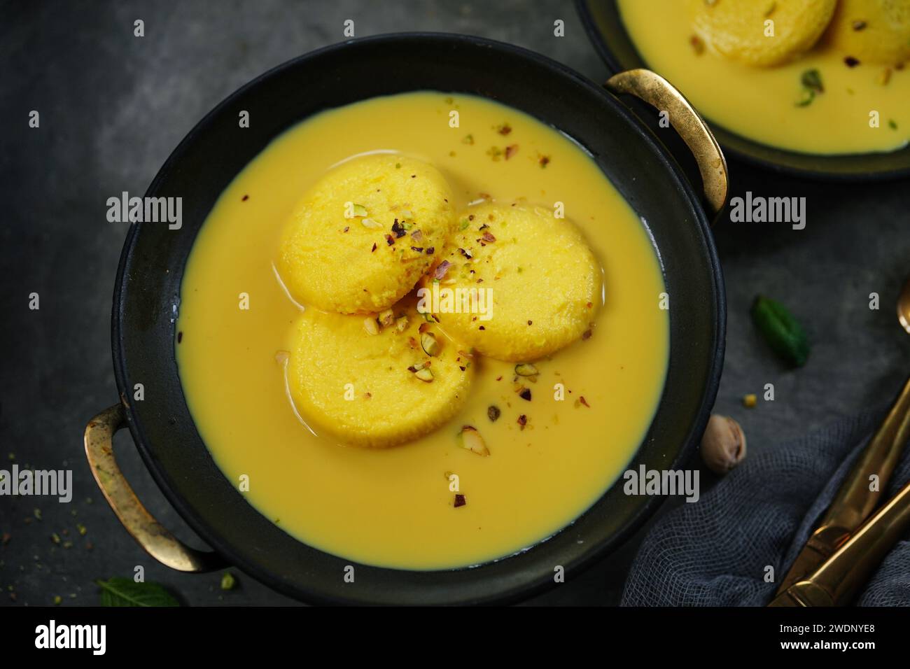 Mango Rasmalai topped with pistachios, selective focus | Indian ...