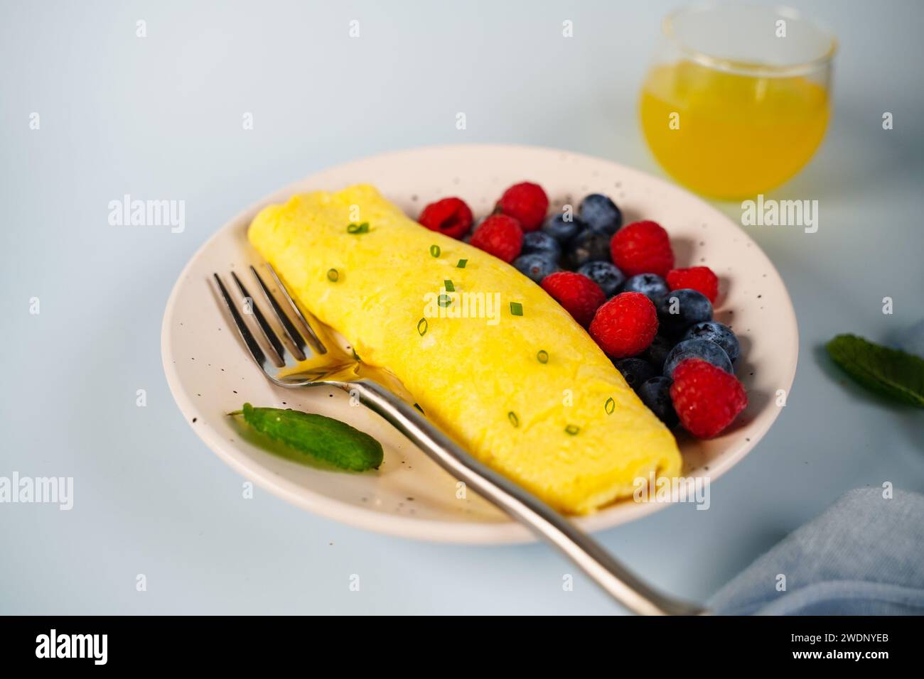 Homemade classic French Omelette served with fresh fruits Stock Photo ...