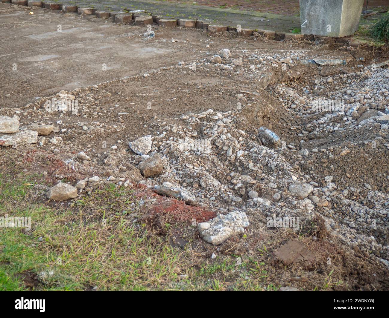 Reconstruction of the bike path. Replacing tiles on a bike path among ...