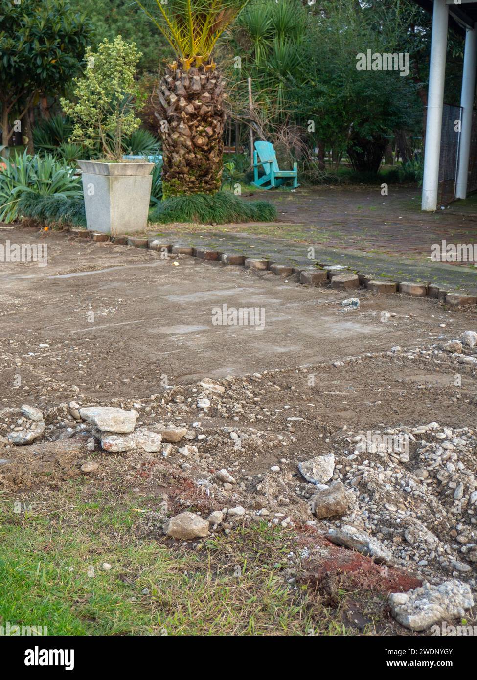 Reconstruction of the bike path. Replacing tiles on a bike path among ...