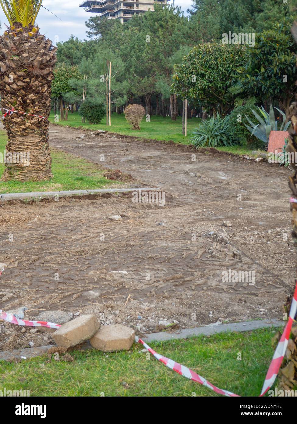 Reconstruction of the bike path. Replacing tiles on a bike path among ...