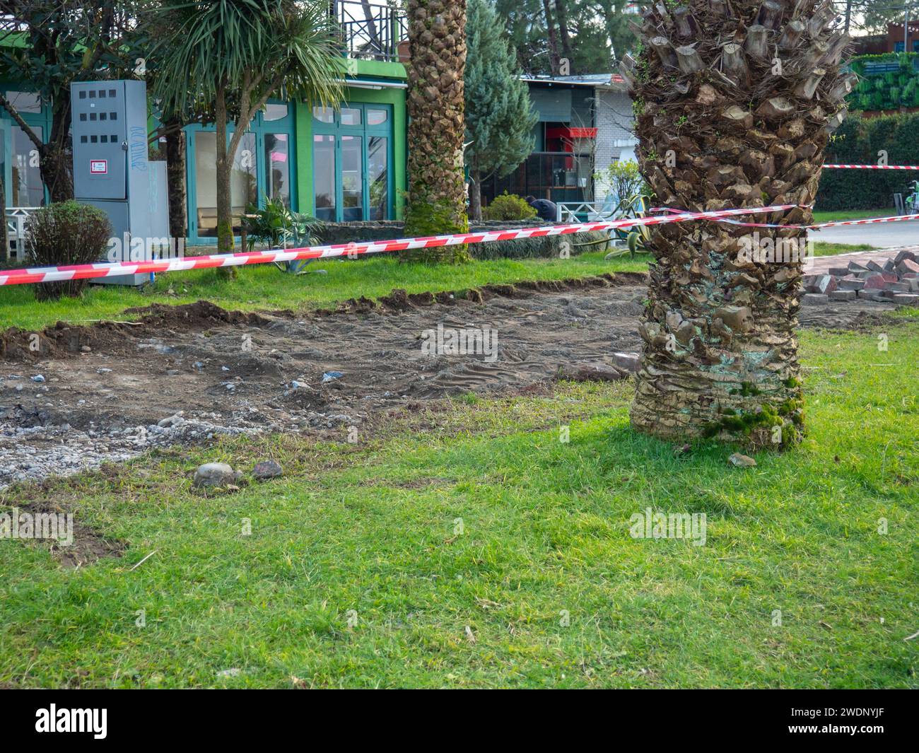 Reconstruction of the bike path. Replacing tiles on a bike path among ...
