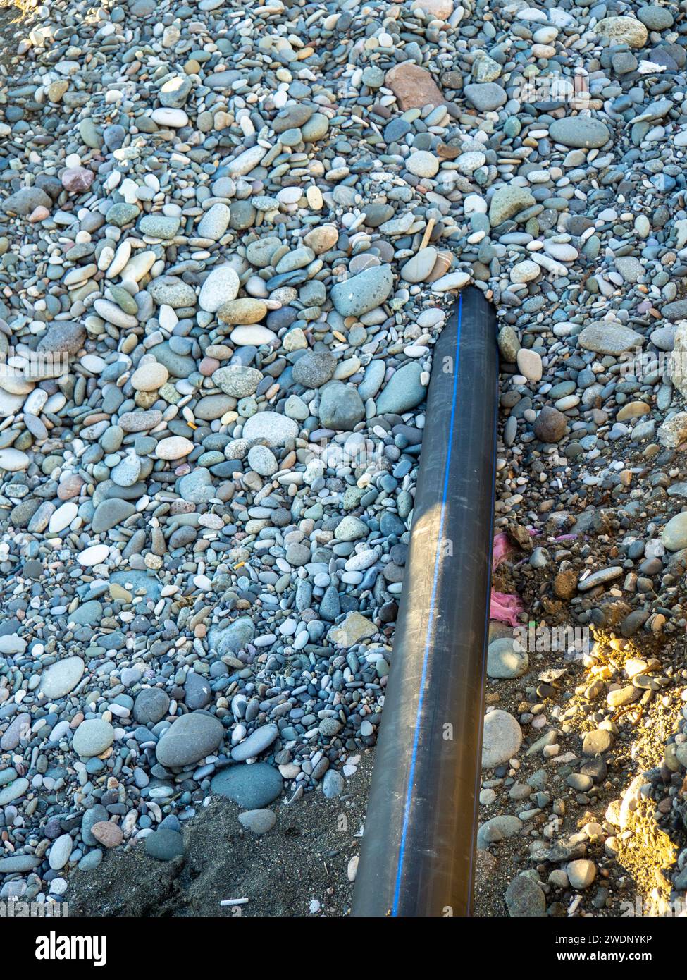 pipe with communications was dug on pebble soil. Electrical networks in ...