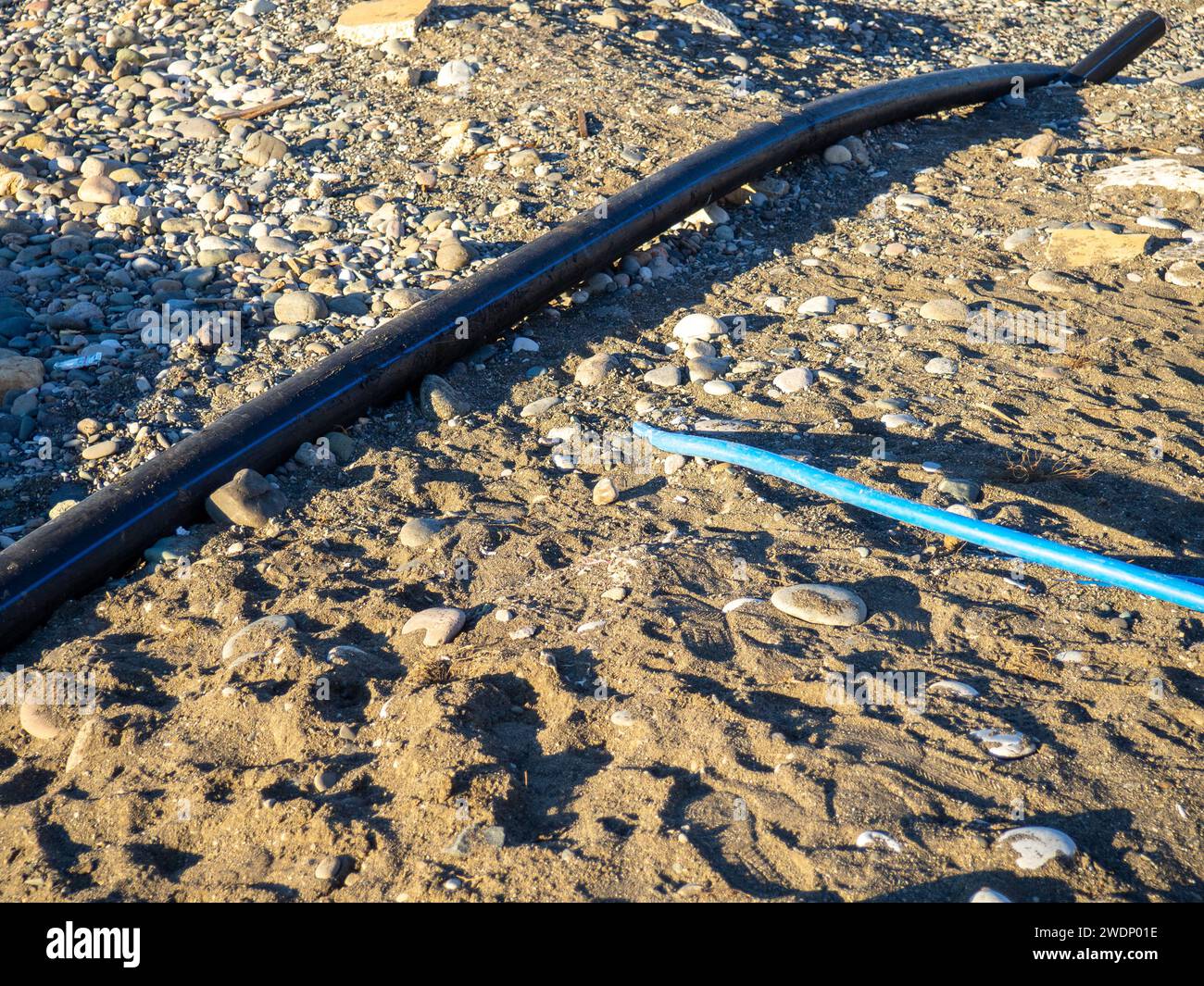 pipe with communications was dug on pebble soil. Electrical networks in ...
