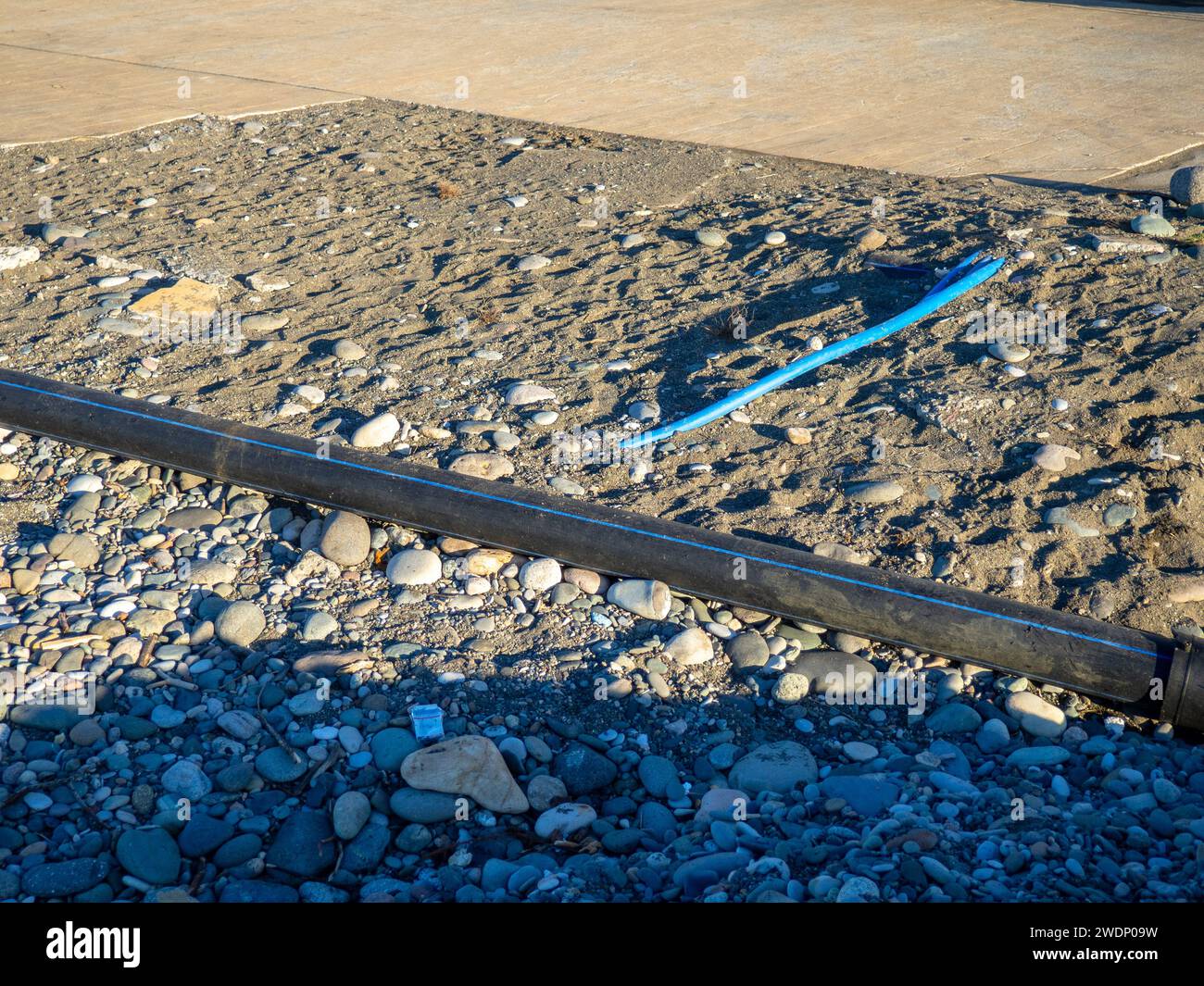 pipe with communications was dug on pebble soil. Electrical networks in ...
