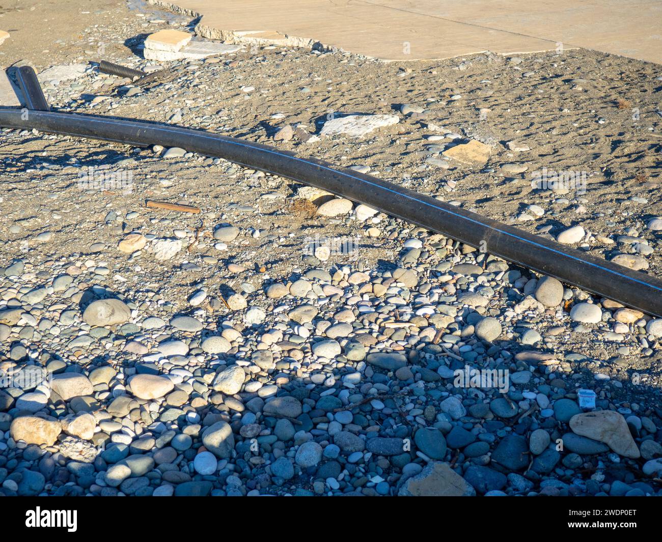 pipe with communications was dug on pebble soil. Electrical networks in ...
