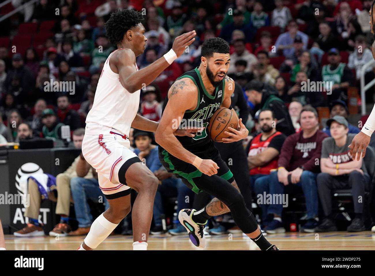 Boston Celtics' Jayson Tatum (0) drives toward the basket as Houston ...