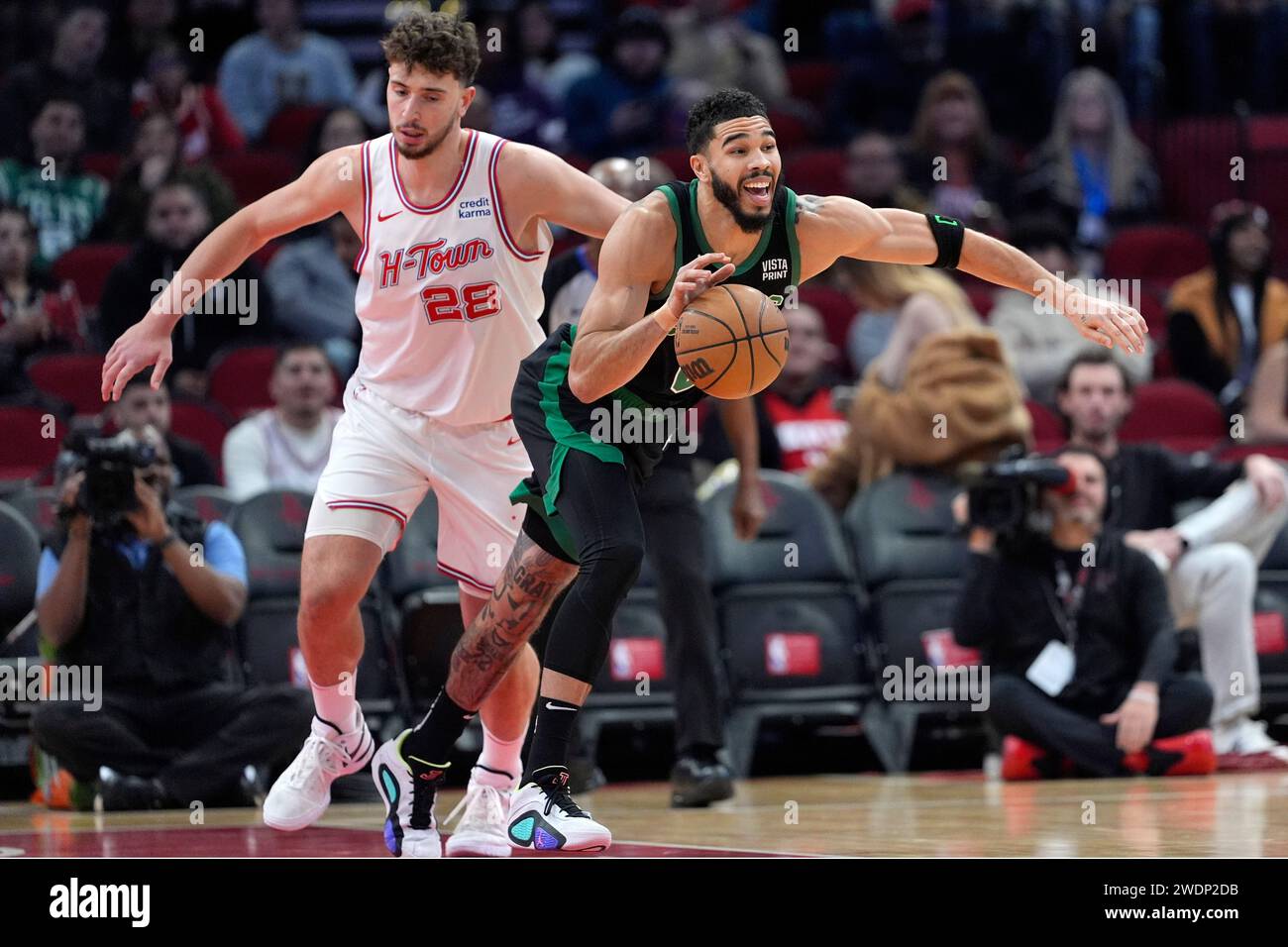 Boston Celtics' Jayson Tatum, right, is fouled by Houston Rockets ...