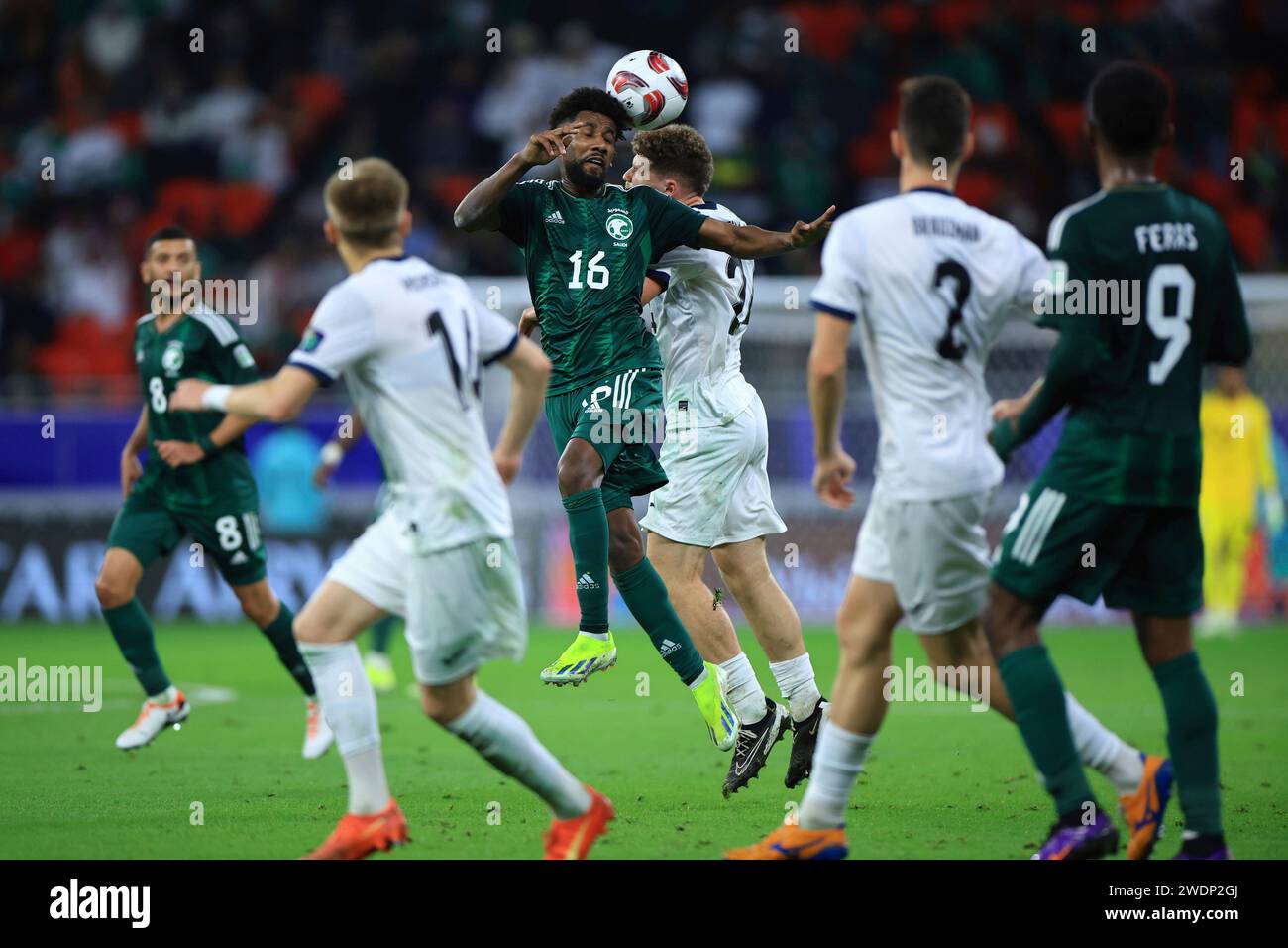 Saudi Arabia's Sami Al-Najei (C) heads a ball during the AFC Asian Cup ...