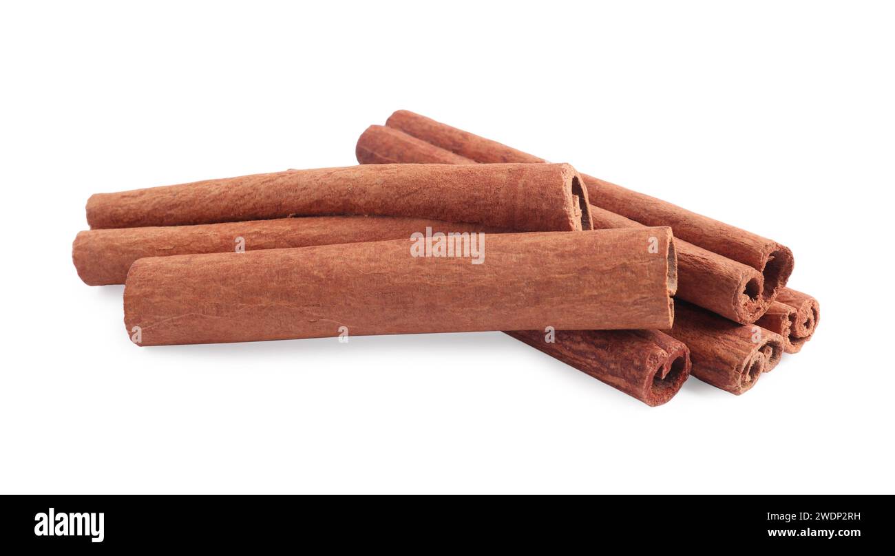 Dry aromatic cinnamon sticks isolated on white Stock Photo - Alamy
