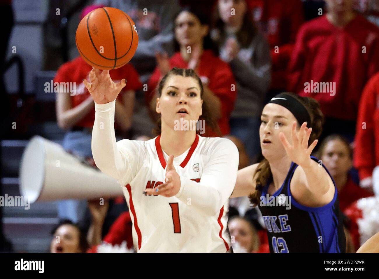 North Carolina State's River Baldwin (1) passes the ball while being ...