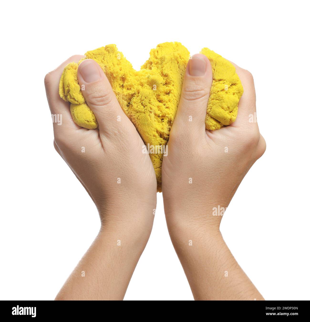 Woman playing with yellow kinetic sand on white background, closeup ...