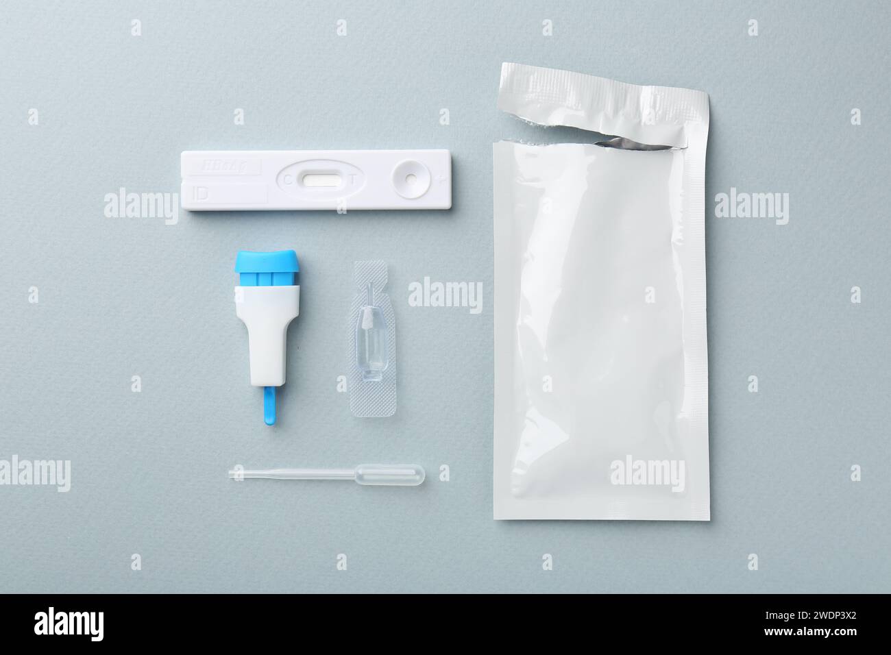 Disposable express test kit on light blue background, flat lay Stock ...