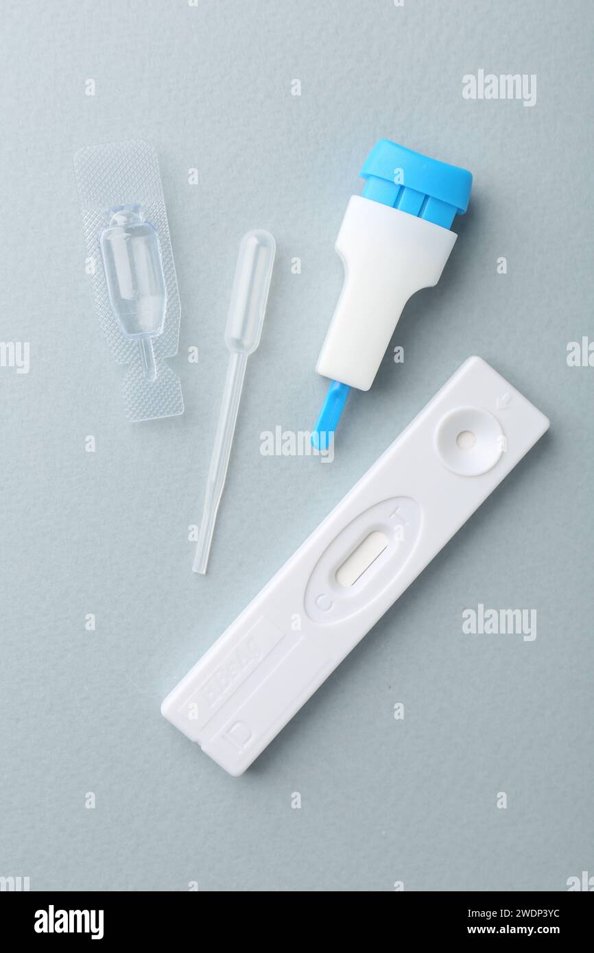Disposable express test kit on light blue background, flat lay Stock ...