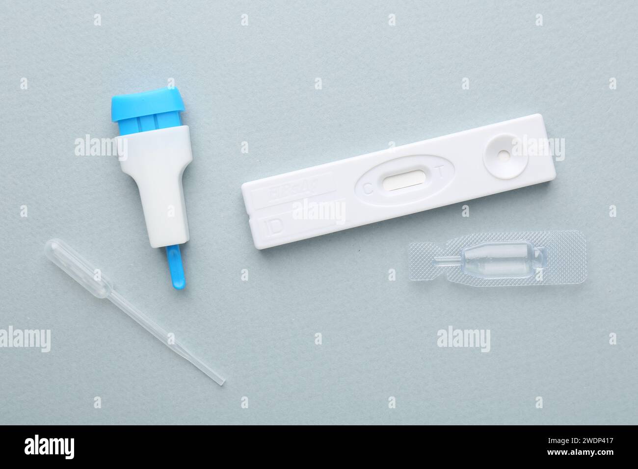 Disposable express test kit on light blue background, flat lay Stock ...