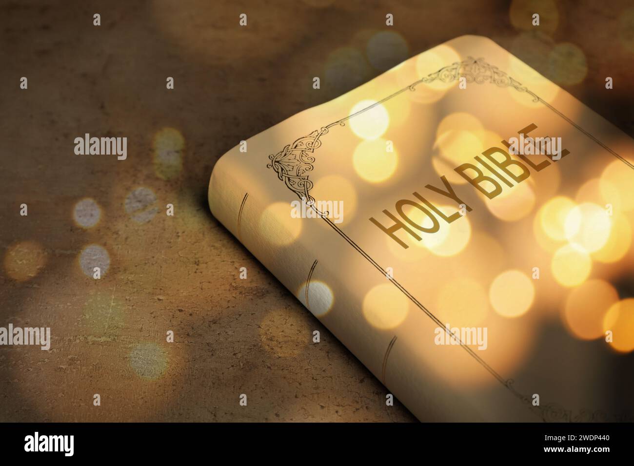 Holy Bible on stone table, bokeh effect Stock Photo - Alamy