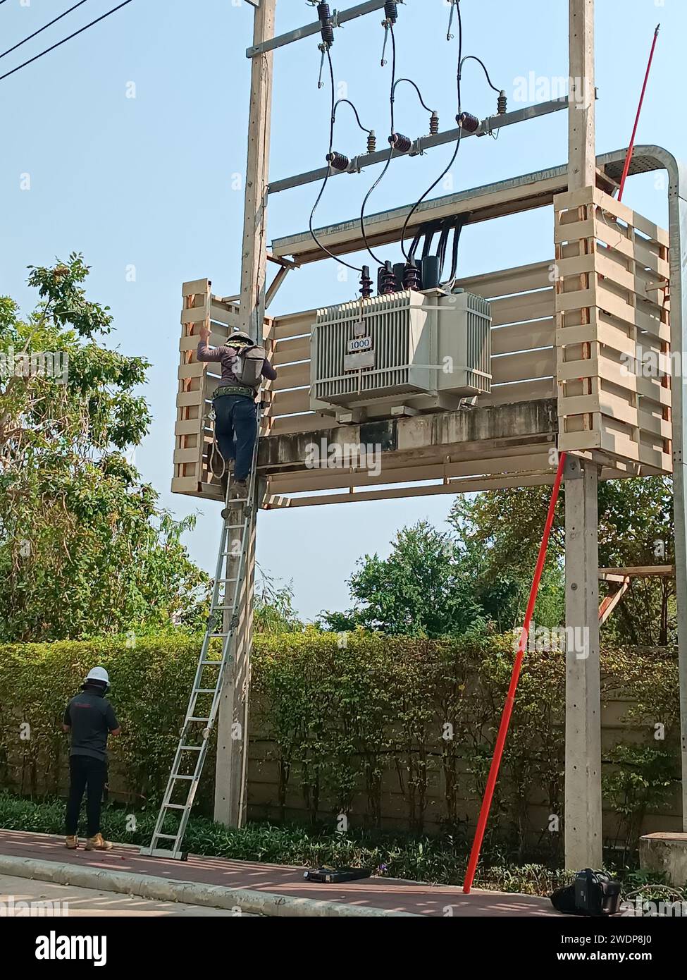 Using a ladder hi-res stock photography and images - Alamy