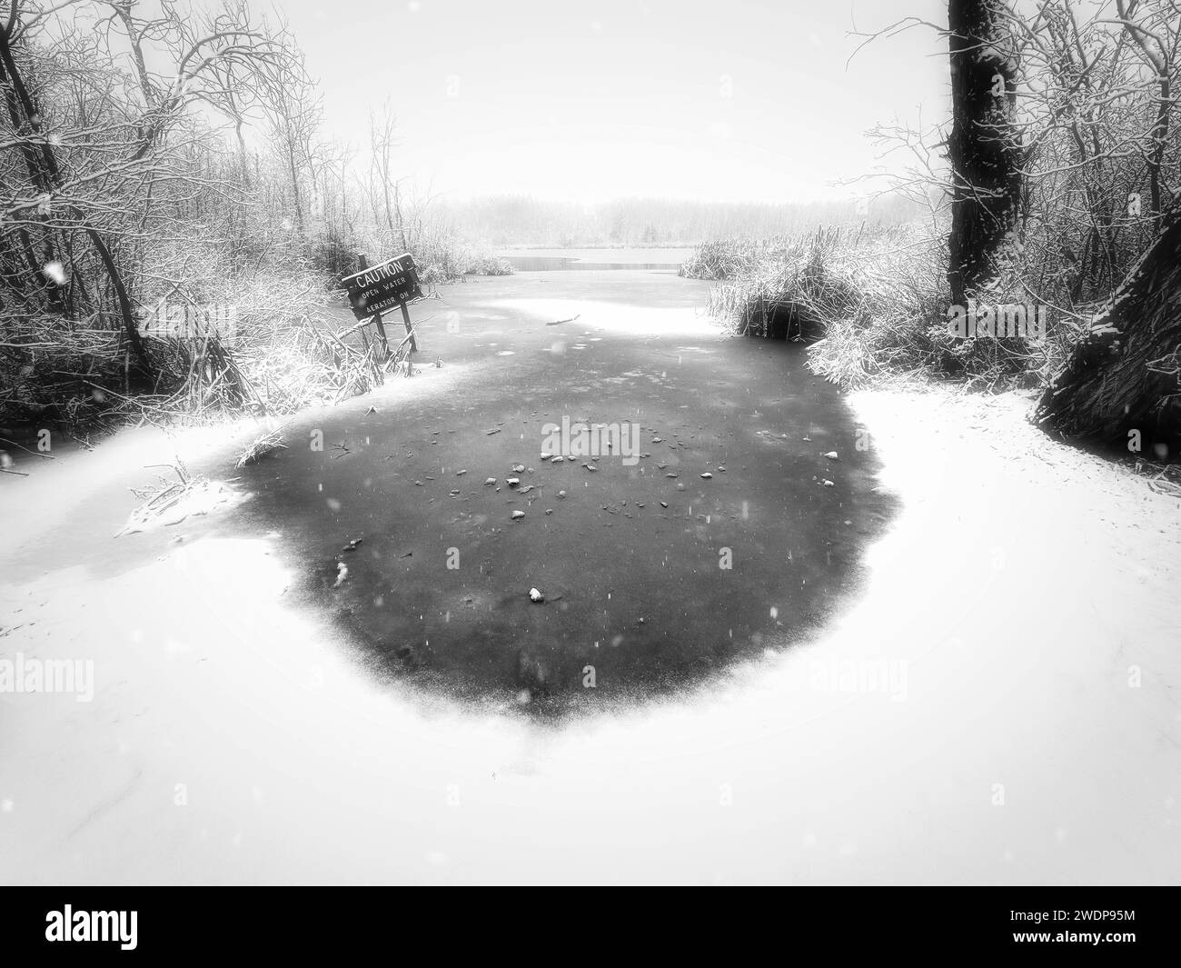 The dock area of an inland lake during a January snow storm near ...