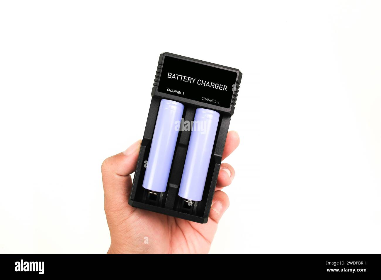 Battery charger isolated in hand on white background , battery charger ...