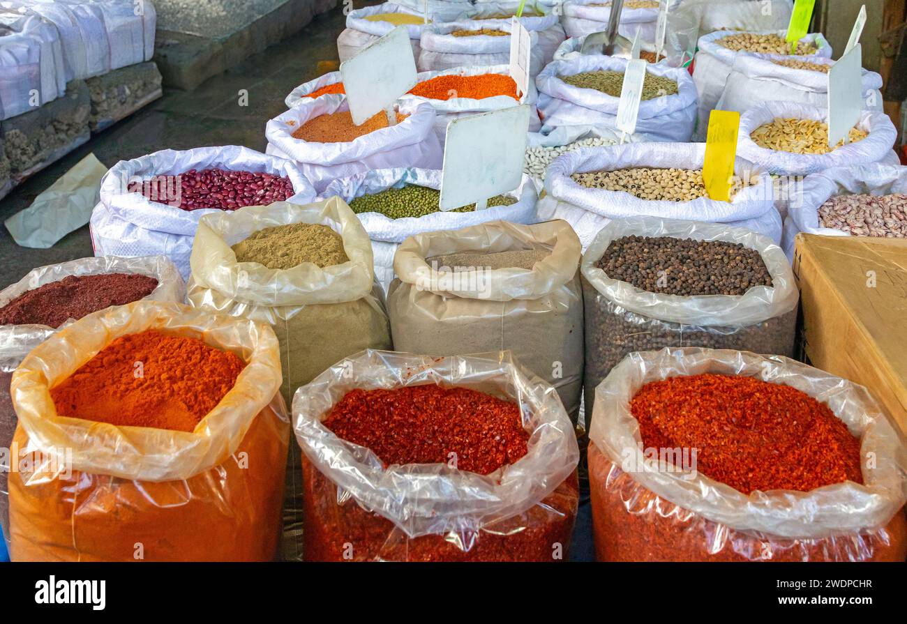 Oriental colorful spices and pulses in large sacks sold outside on a ...