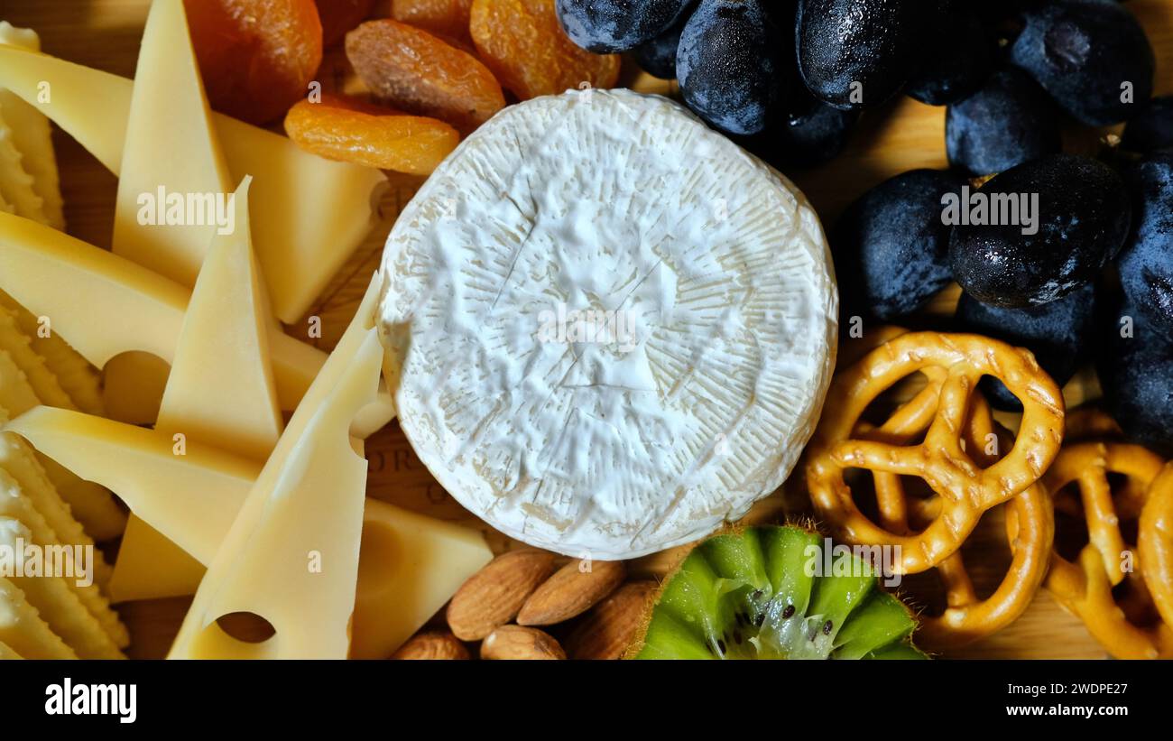 Brillat-savarin, french cheese decorated with some slices of another ...