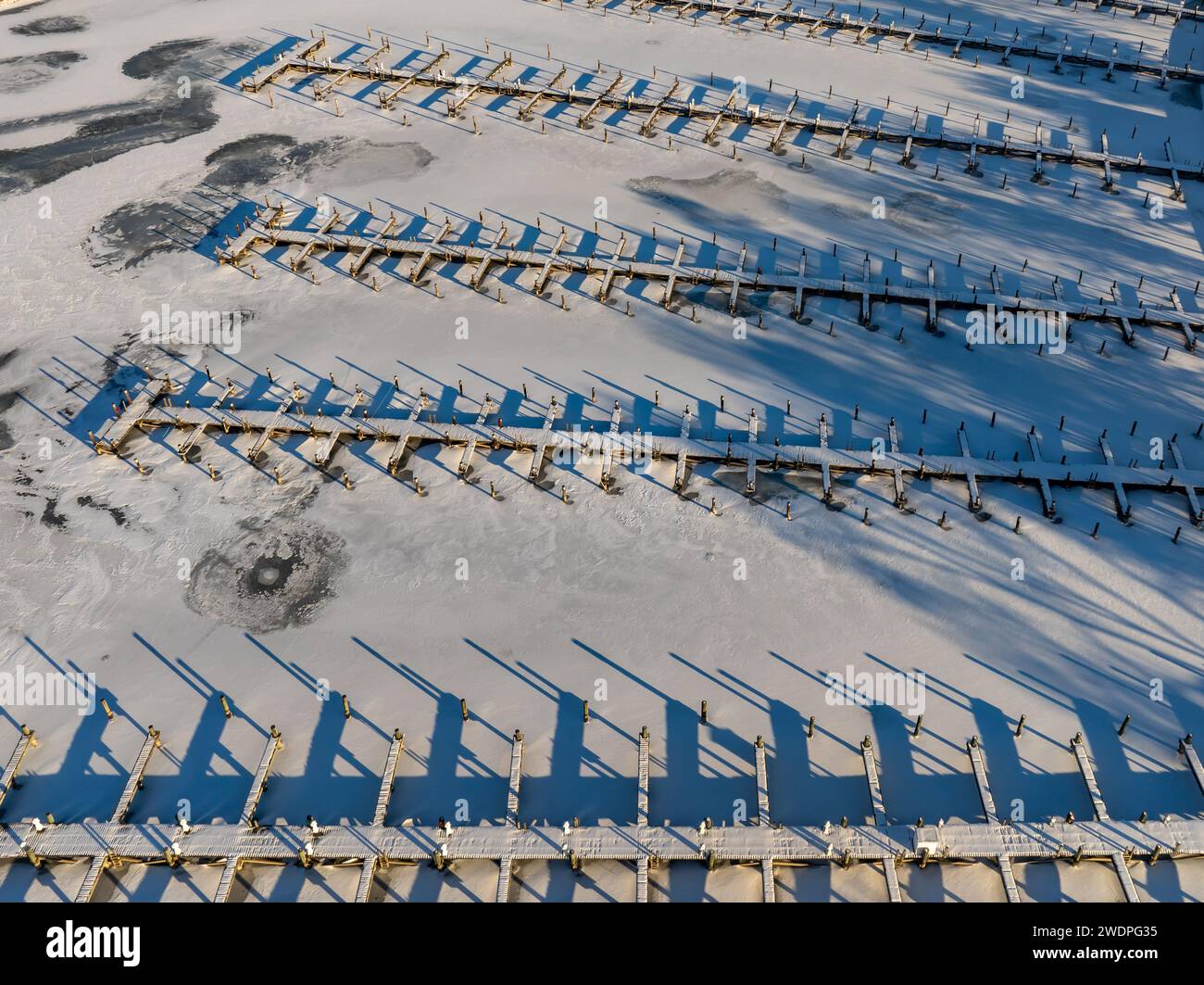 Winter aerial photo of frozen, snowy marina, docks at Allan H Treman ...