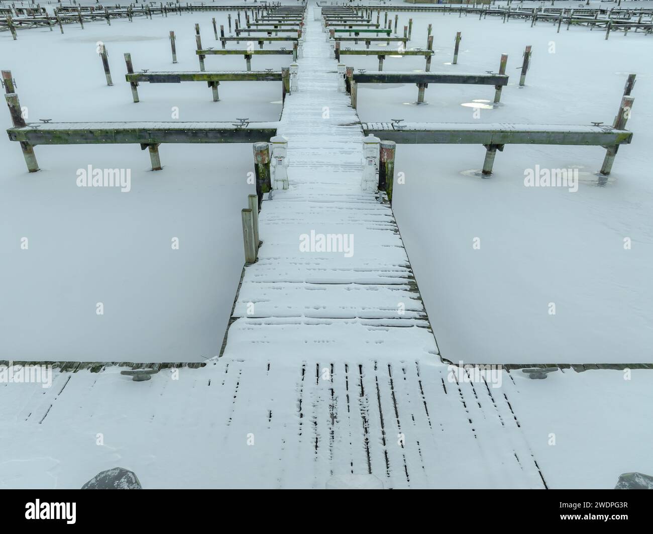 Winter aerial photo of frozen, snowy marina, docks at Allan H Treman ...
