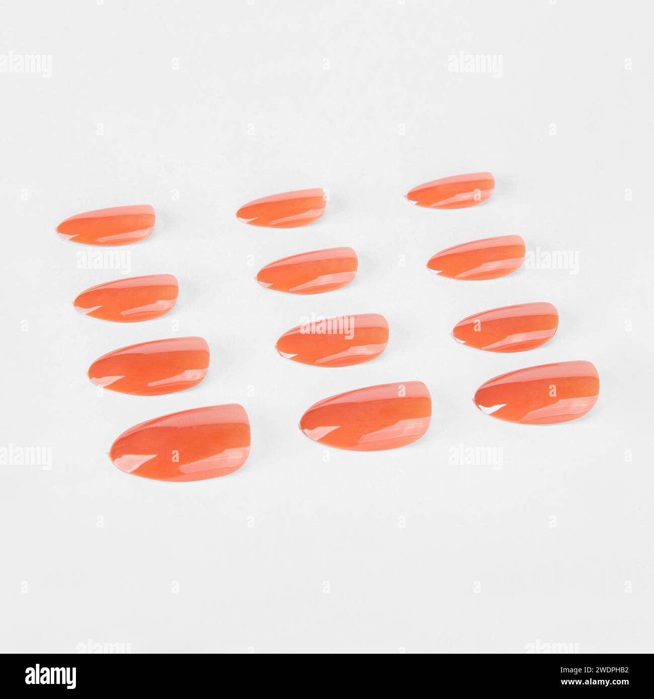 realistic set of colored false nails adhesive isolated on white ...