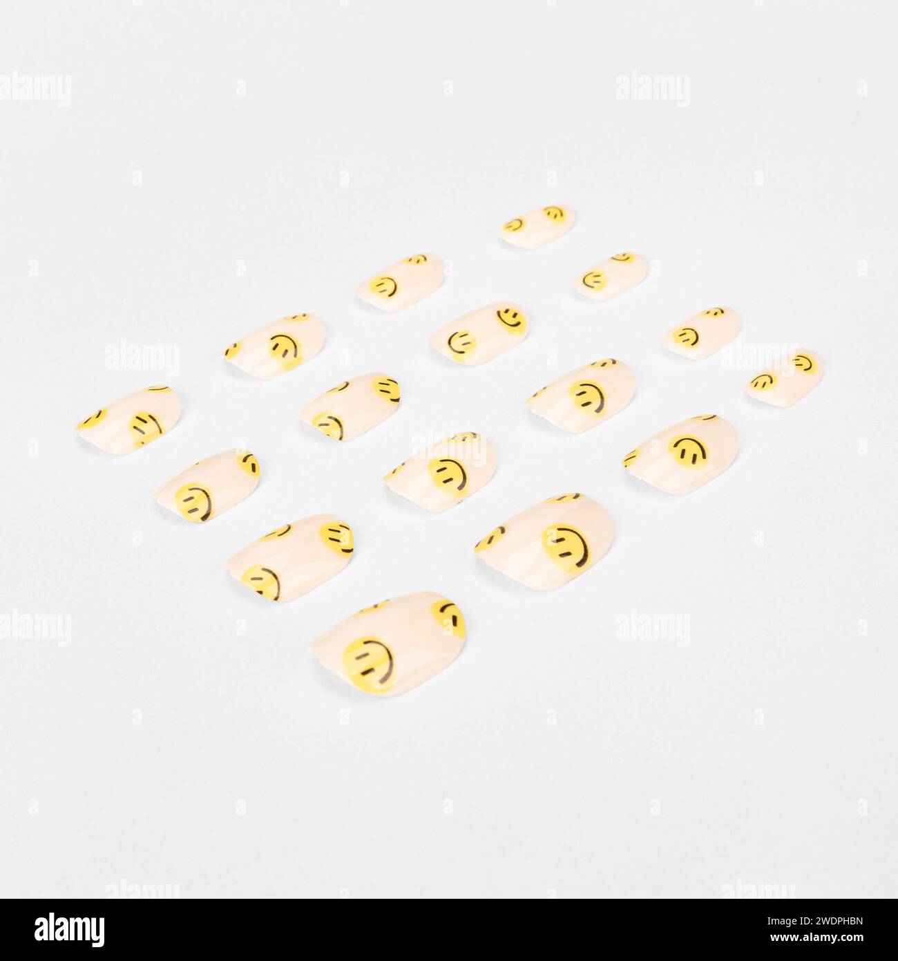 realistic set of colored false nails adhesive isolated on white ...