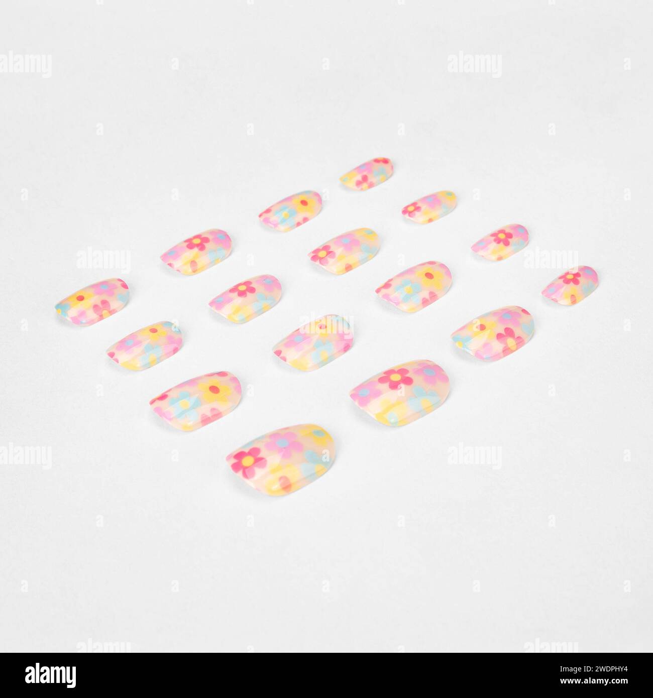 realistic set of colored false nails adhesive isolated on white ...