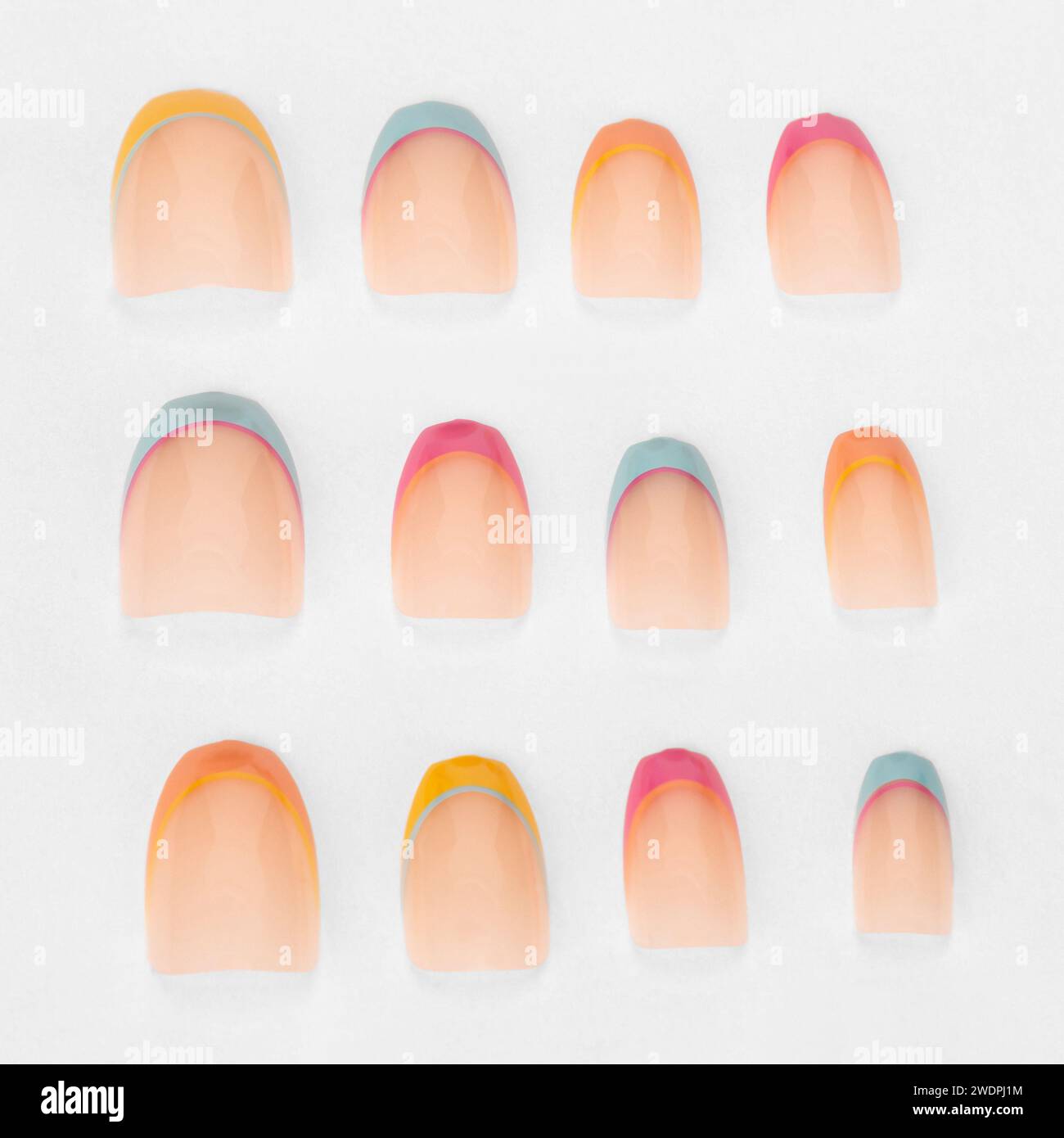 realistic set of colored false nails adhesive isolated on white ...