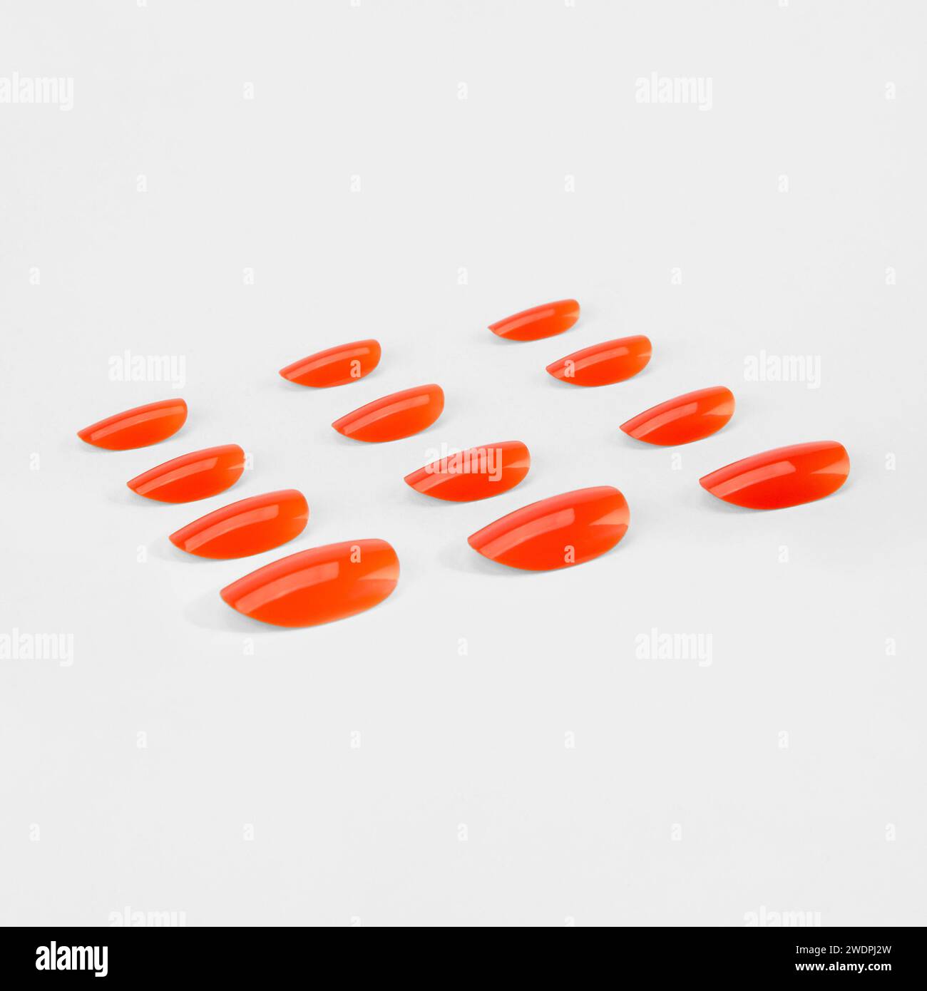 Realistic Set Of Colored False Nails Adhesive Isolated On White Background Top View False