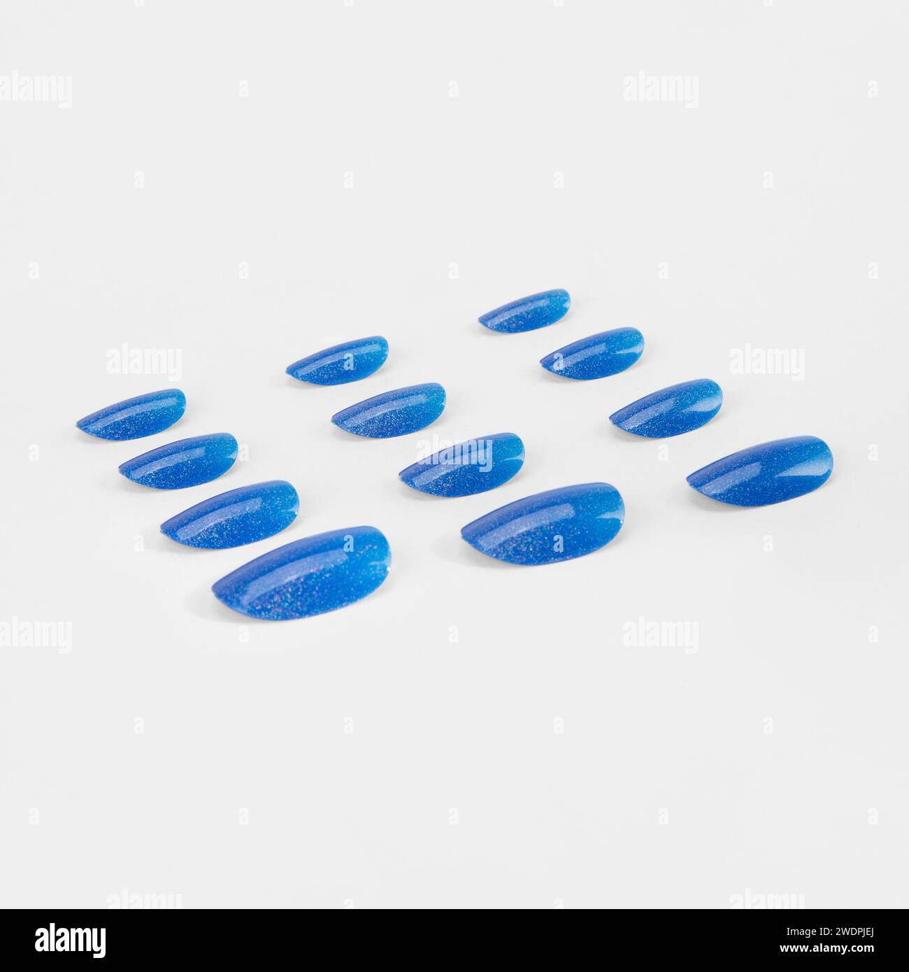 realistic set of colored false nails adhesive isolated on white ...