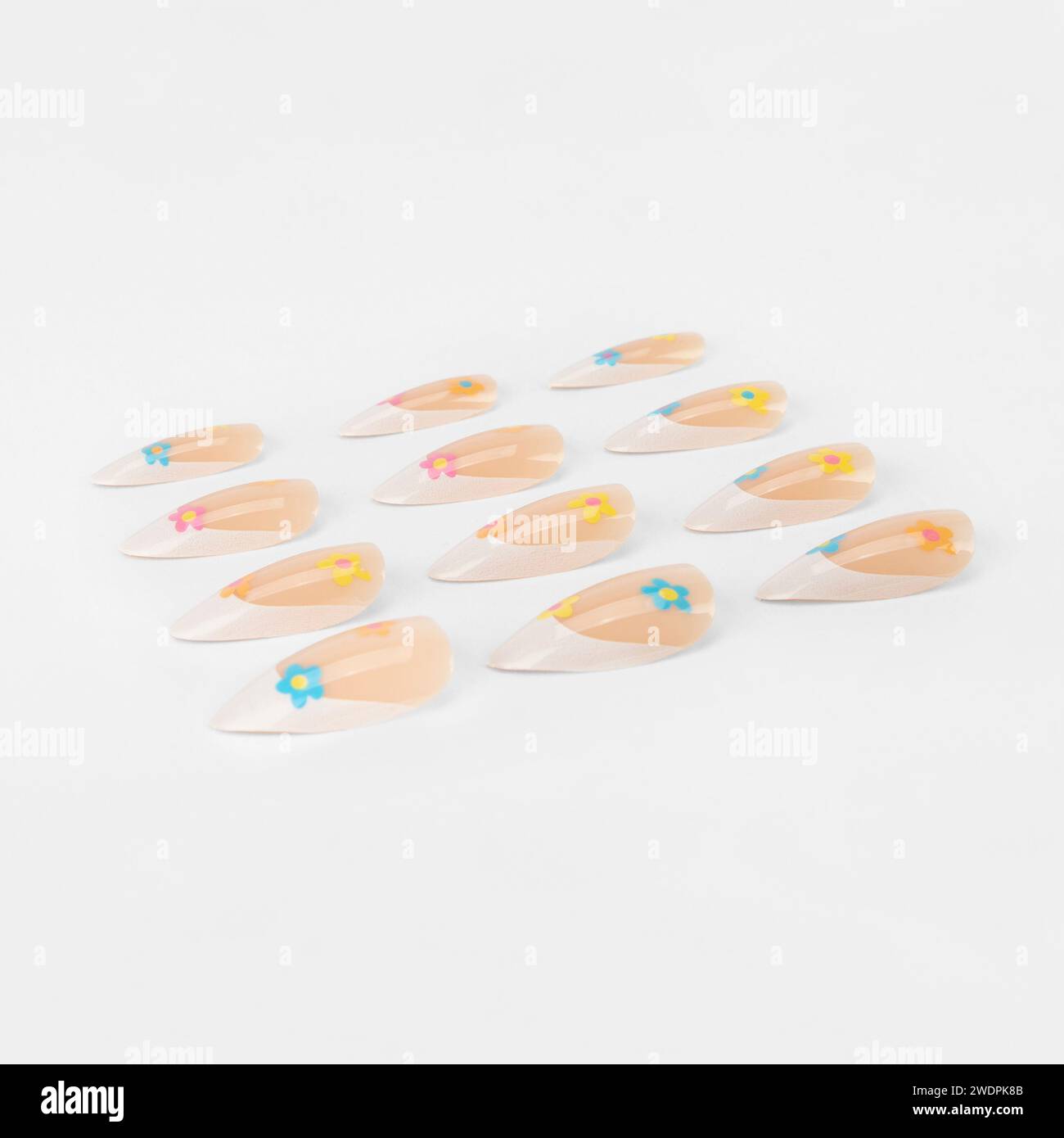 realistic set of colored false nails adhesive isolated on white ...