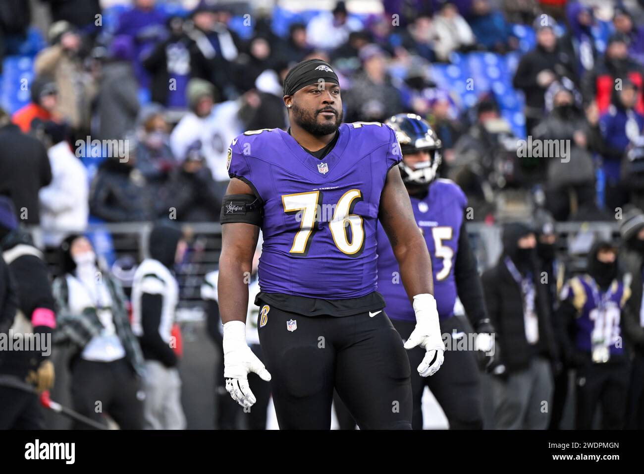 Baltimore Ravens guard John Simpson (76) looks on during pre-game warm ...