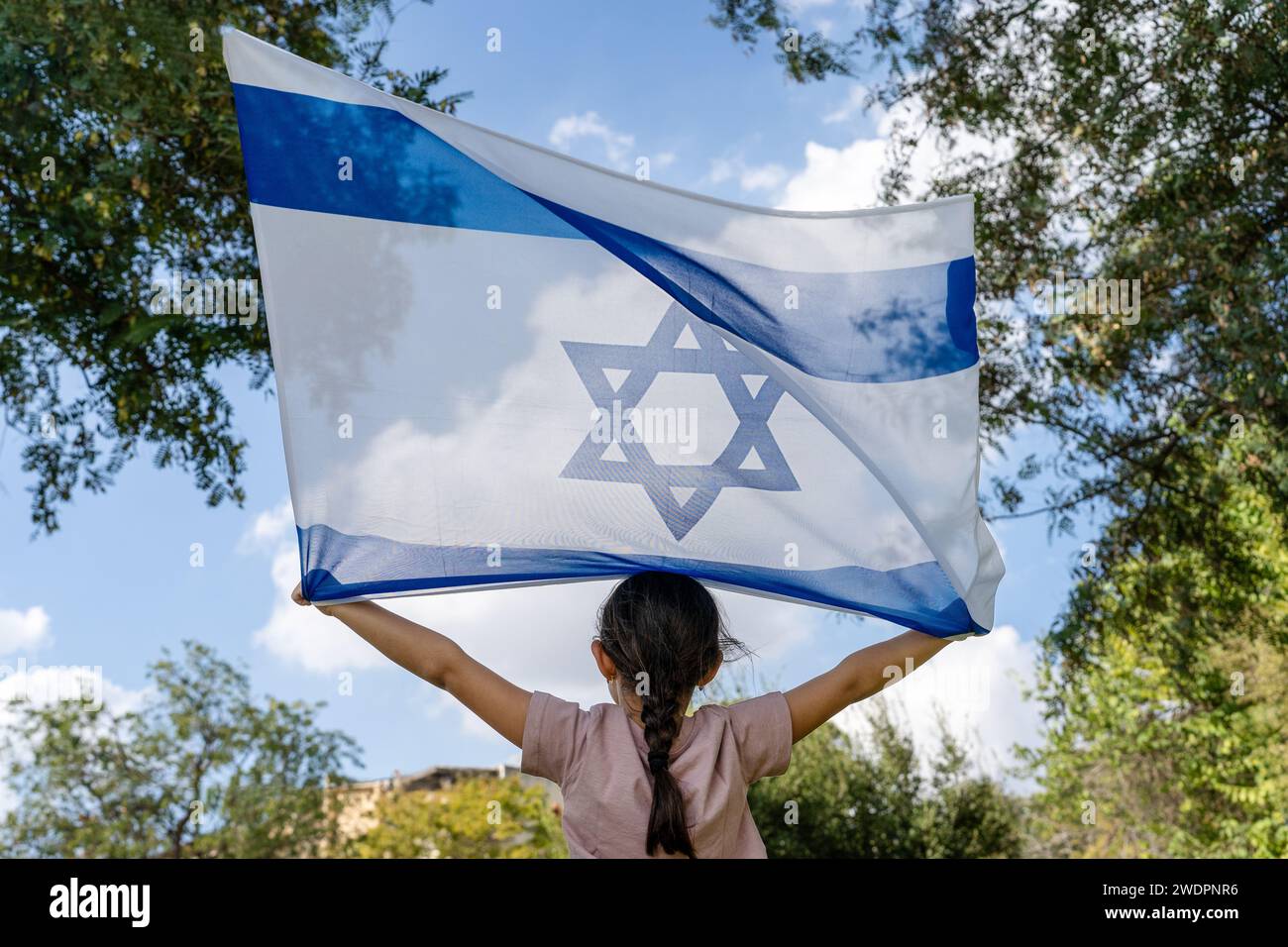 Back View On Child With Israeli Flag On Blue Sky, Clouds And Nature ...