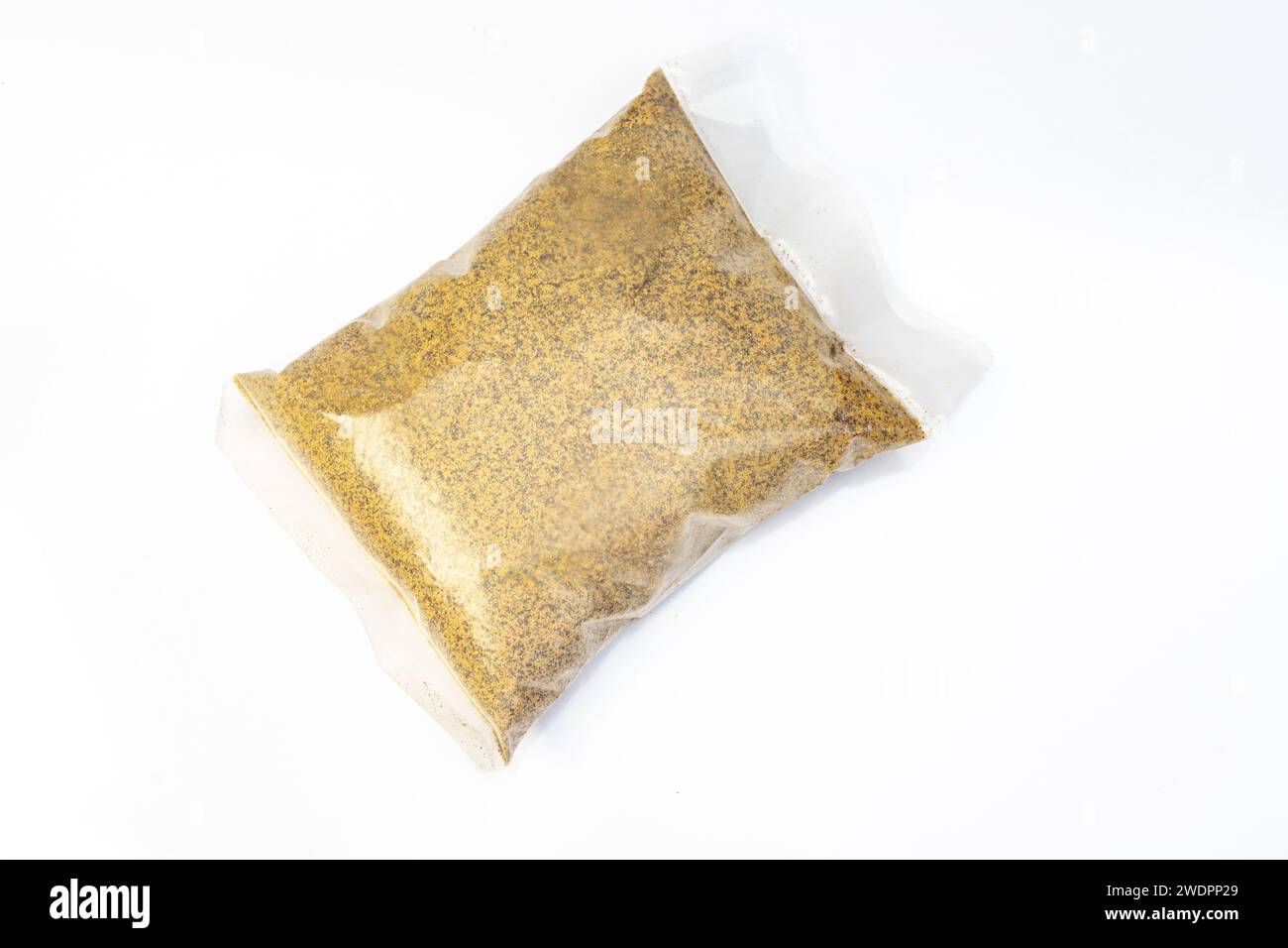Mustard cake powder fertilizer on white background Stock Photo - Alamy