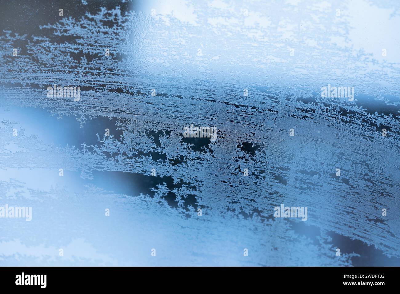 Abstract frosty patterns on a frozen window, background Stock Photo - Alamy
