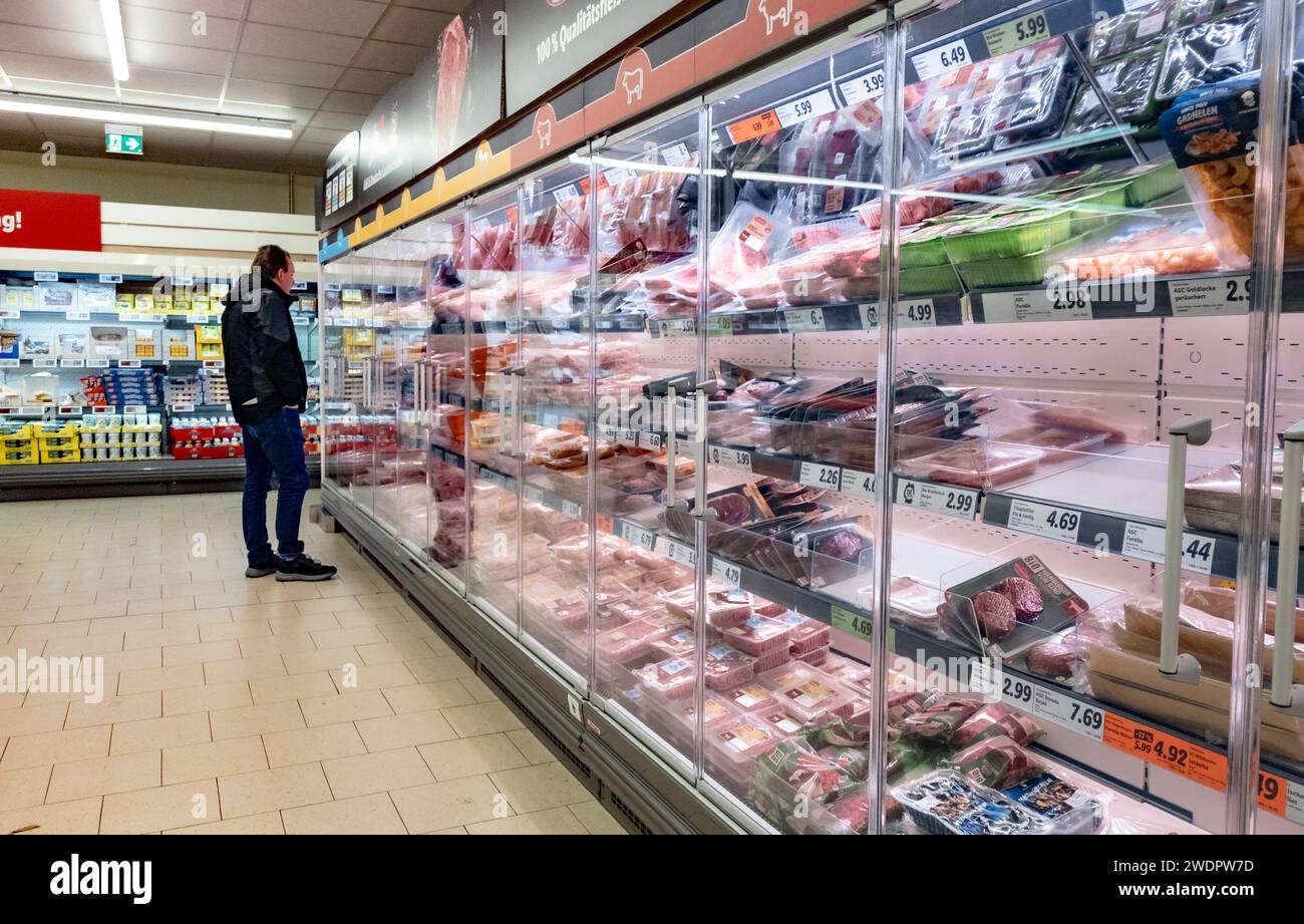 Hamburg, Germany. 20th Jan, 2024. A customer stands in front of the ...