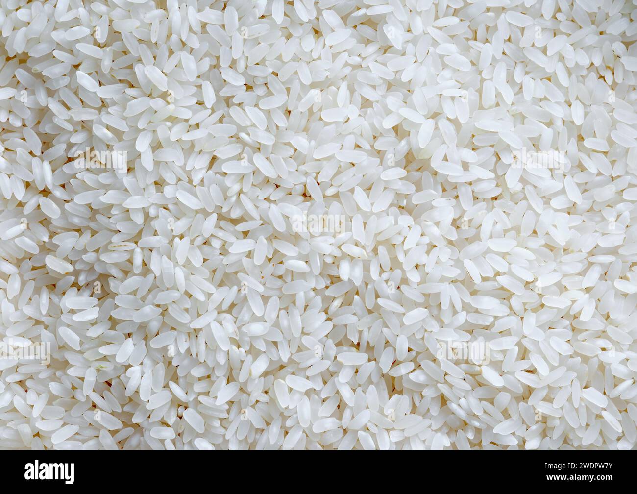 Heap of white rice background Stock Photo - Alamy