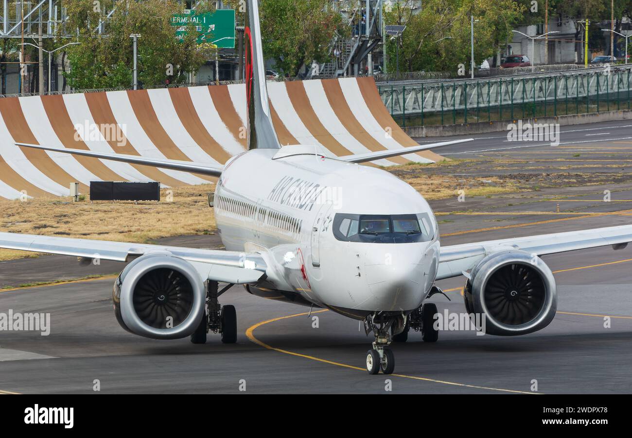 A closeup of an airplane on a runway ready to take off Stock Photo - Alamy