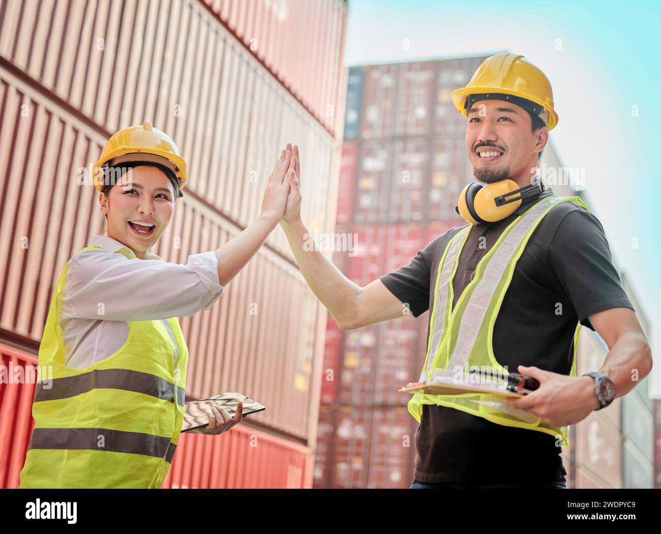 Engineer man and woman with high five , Celebration Success Happiness ...