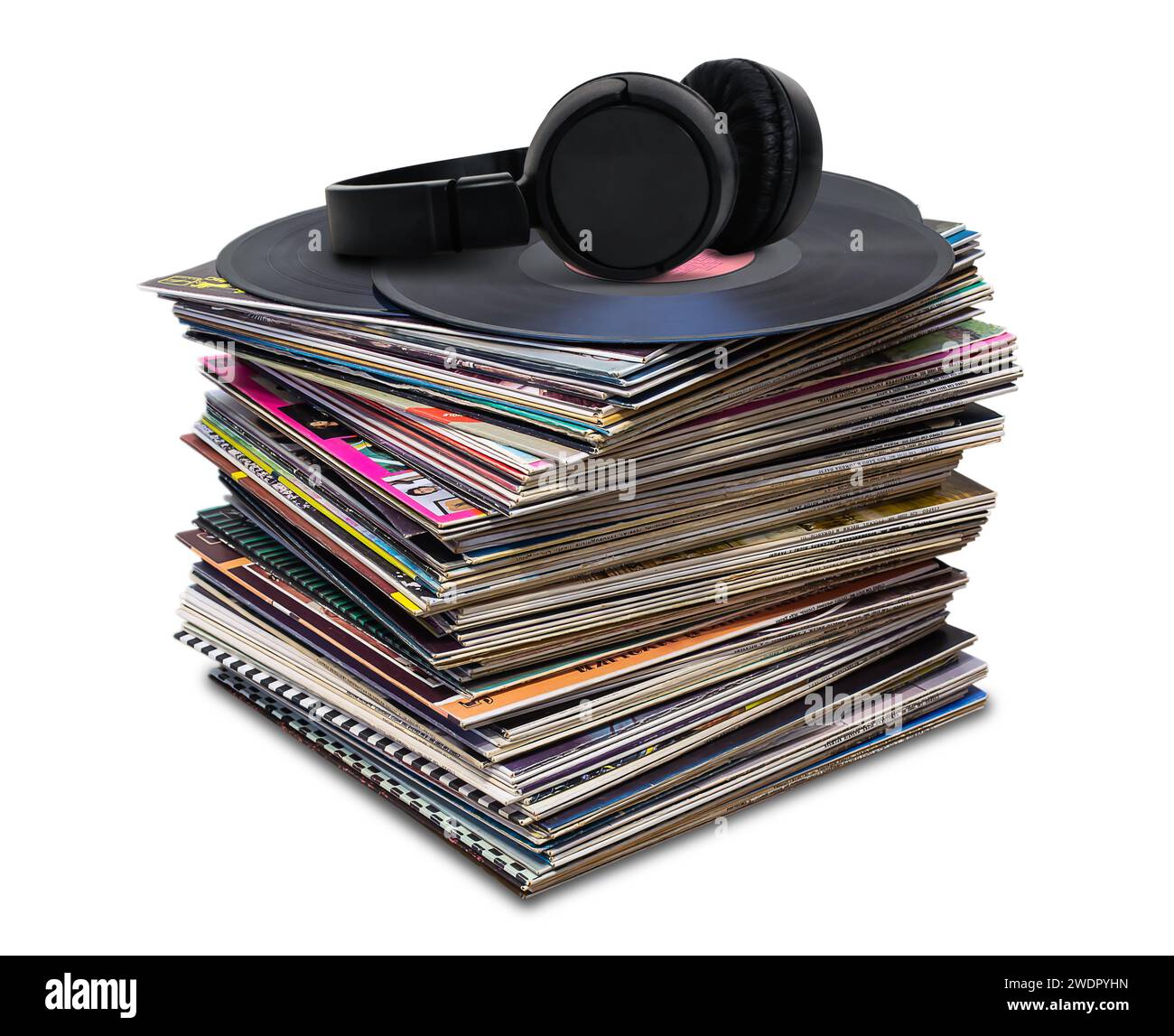 pile of old vinyl discs and headphones isolated on white background ...